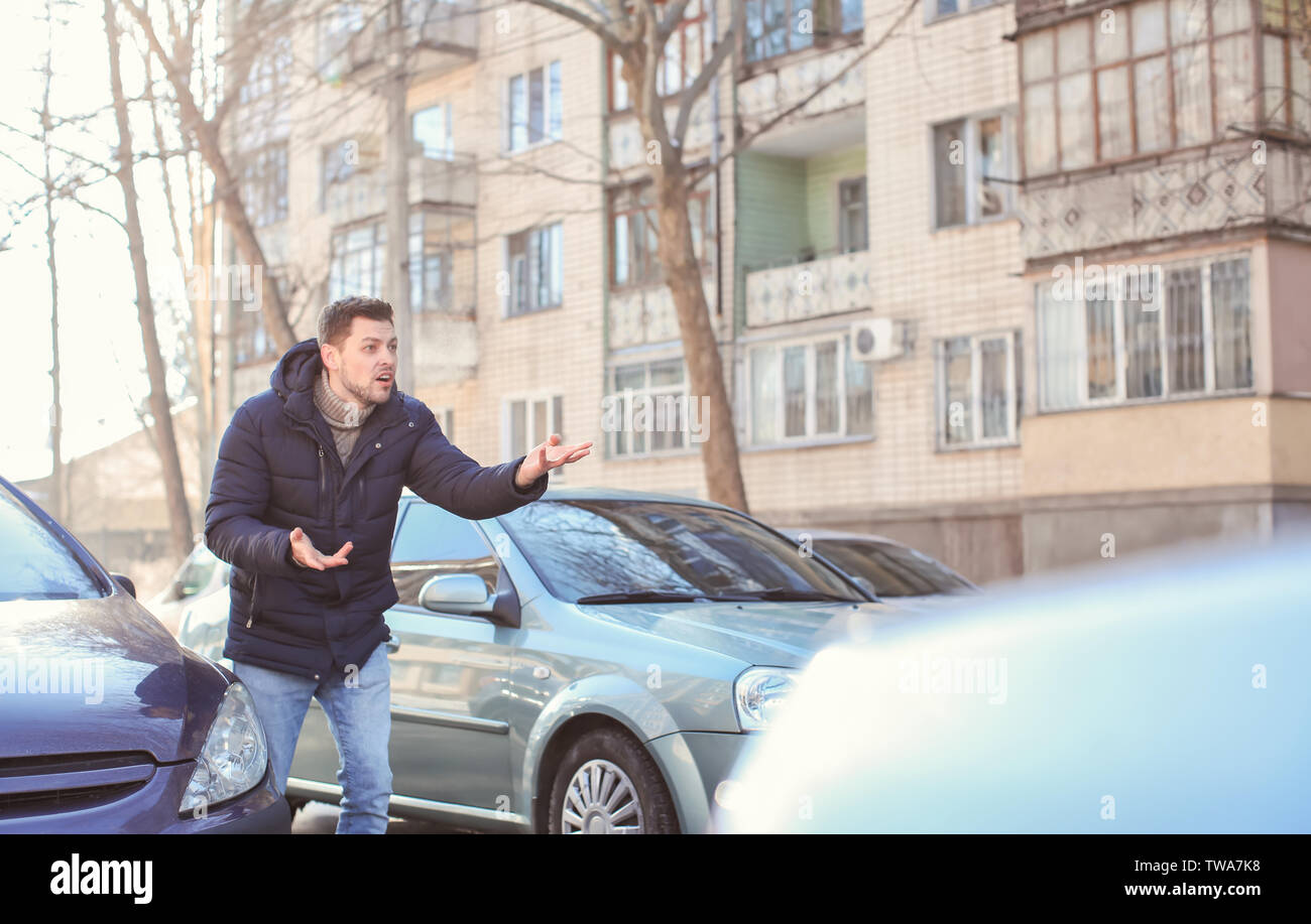 Emotional man in traffic jam on city road Stock Photo - Alamy