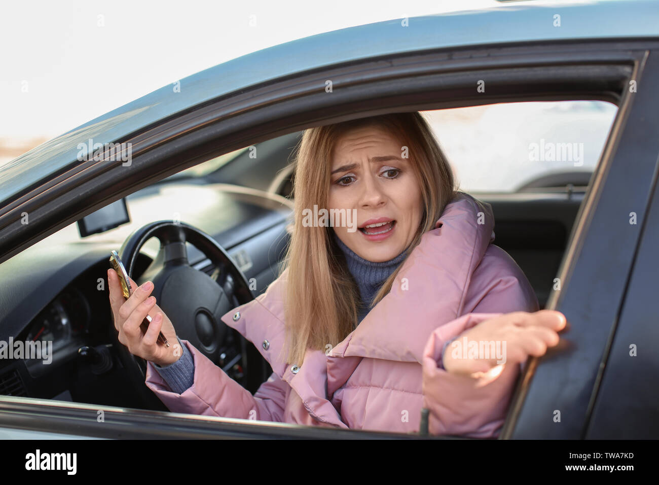 Emotional woman inside car in traffic jam Stock Photo - Alamy