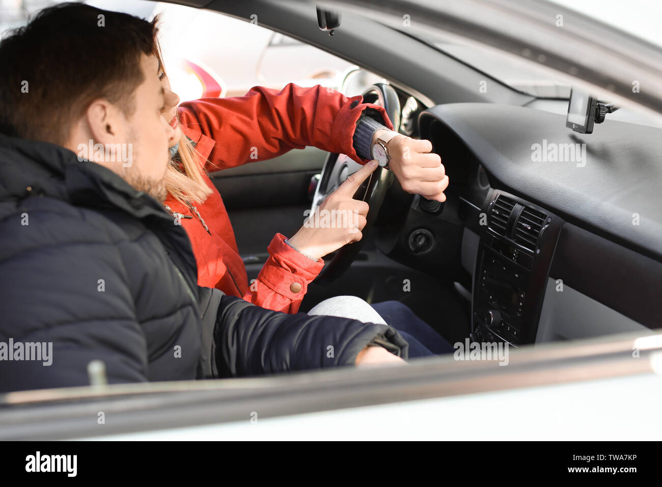 Tired couple inside car in traffic jam Stock Photo - Alamy