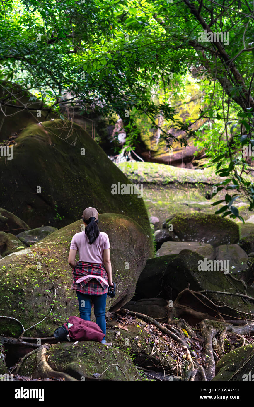 back view photo of girl backpacker travel in rainforest Stock Photo - Alamy
