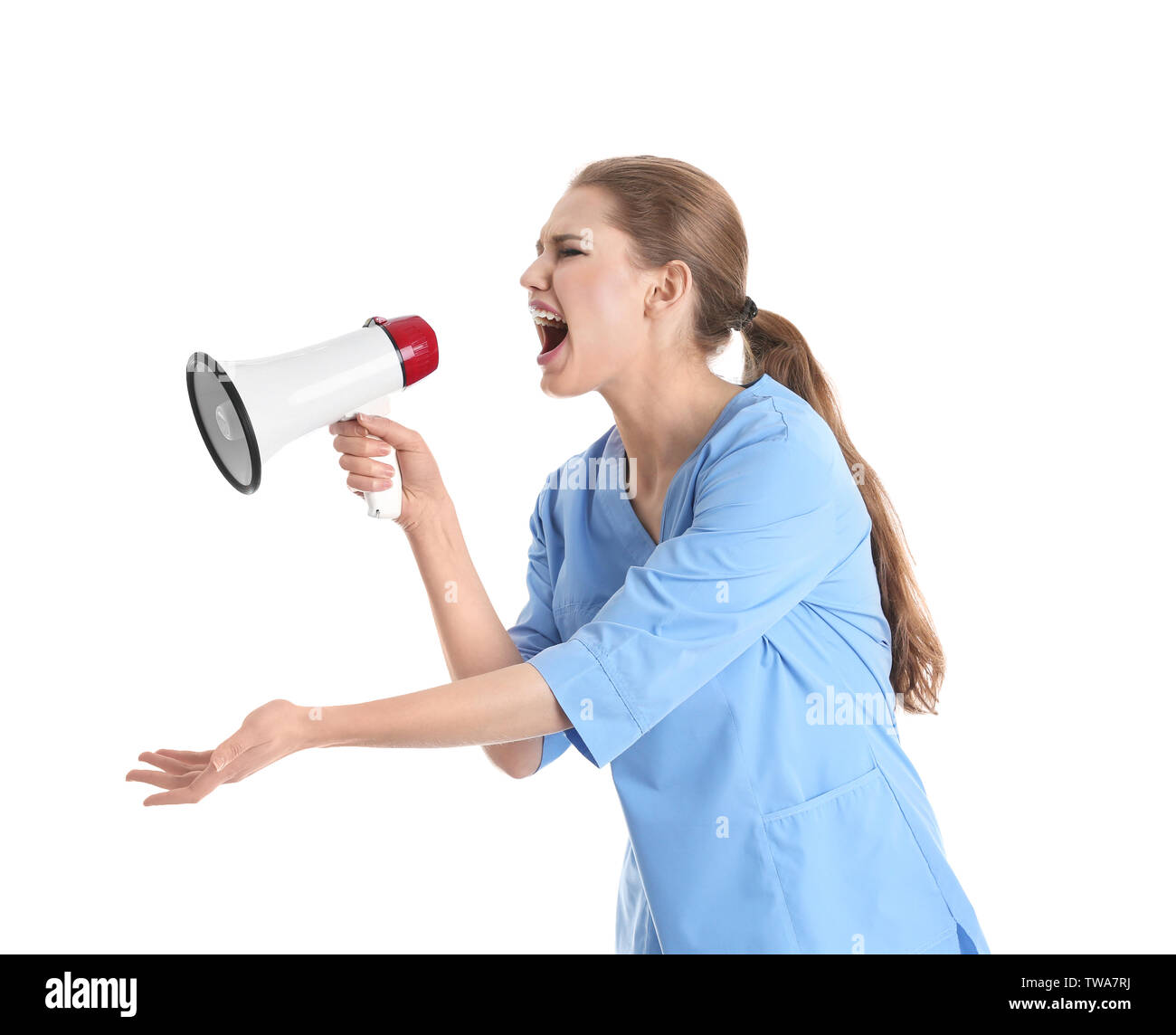 Young female doctor shouting into megaphone on white background Stock ...