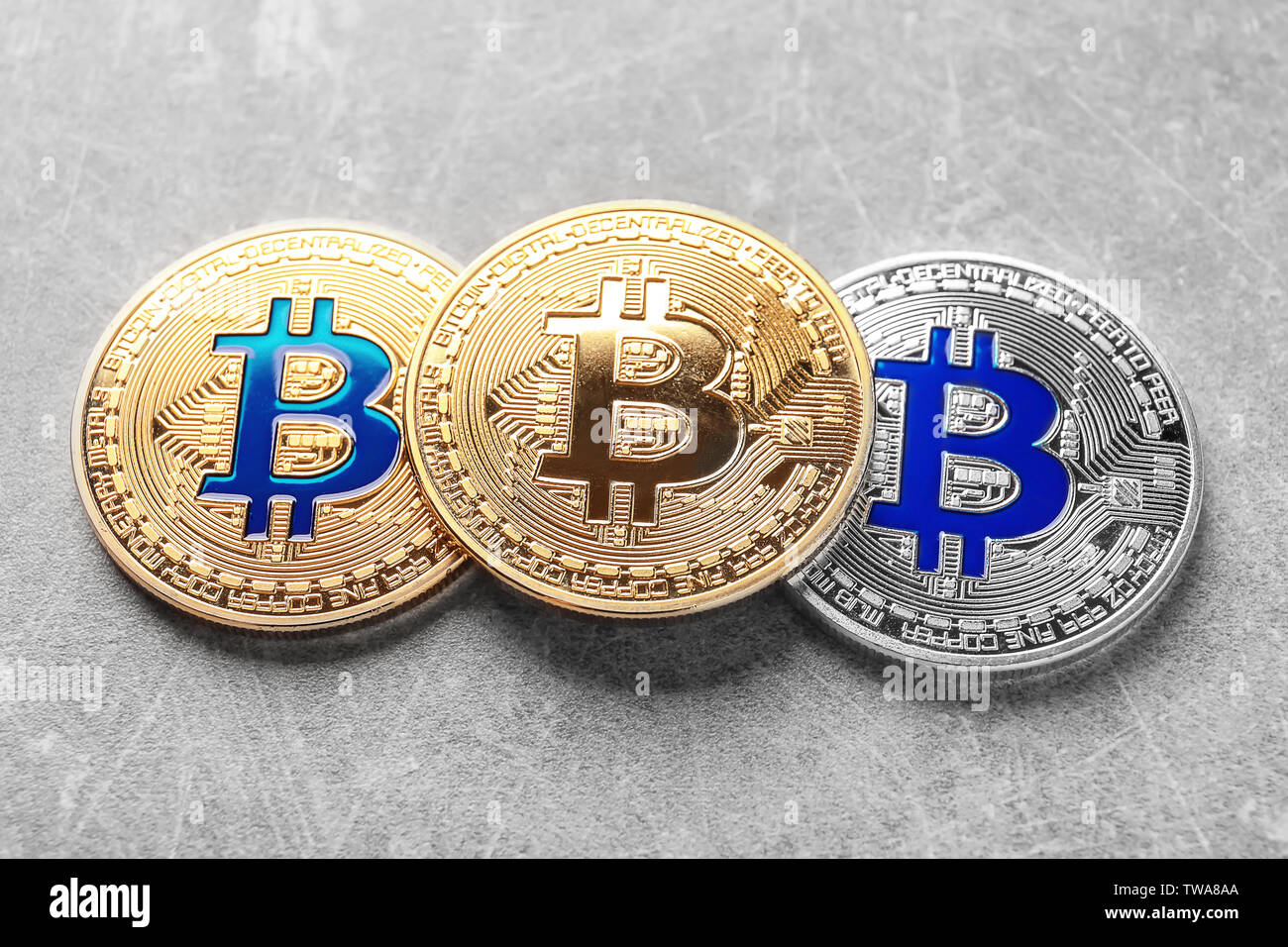 Bitcoins on grey background. Finance trading Stock Photo - Alamy