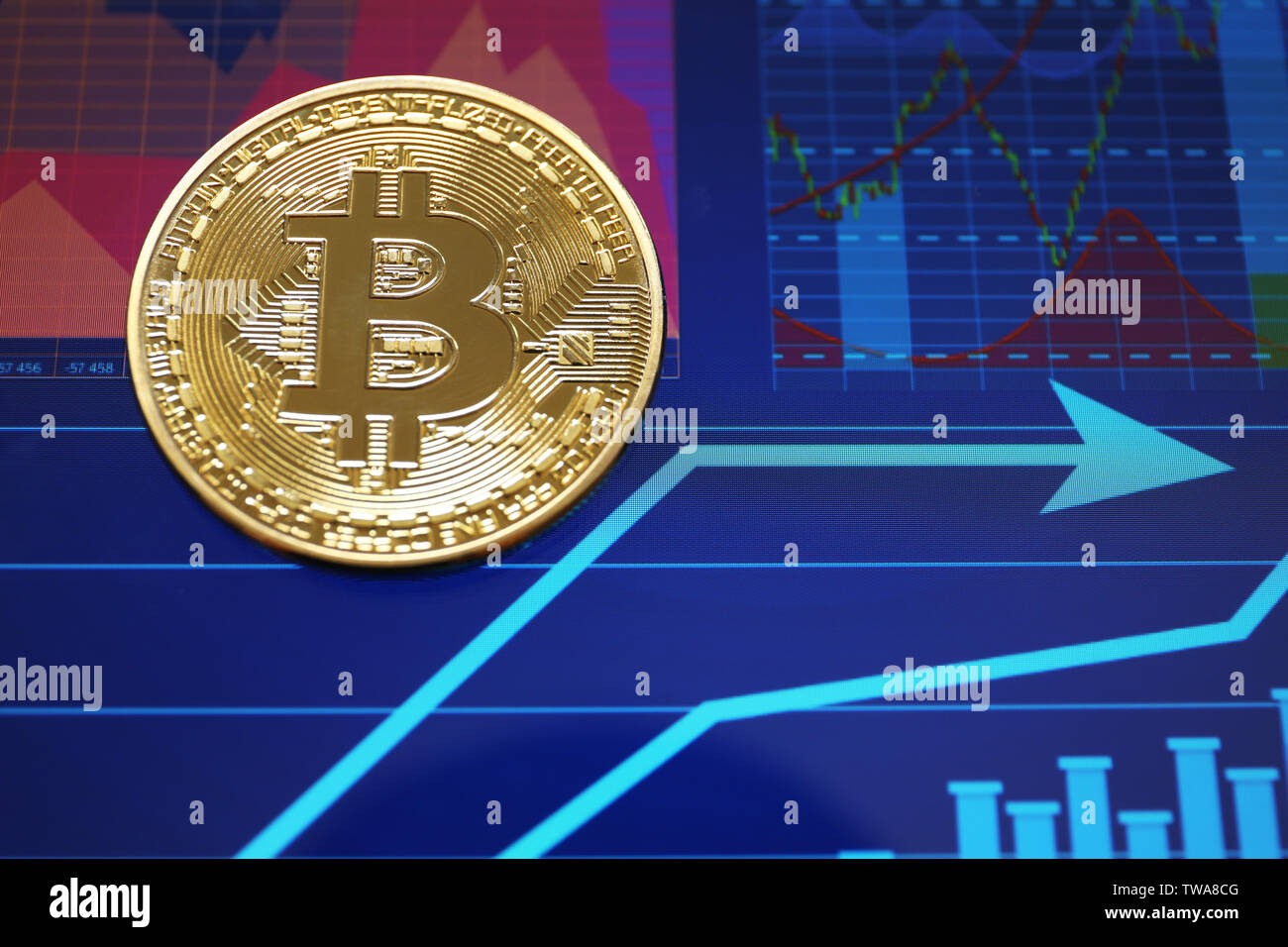 Golden bitcoin on screen with chart. Finance trading Stock Photo - Alamy
