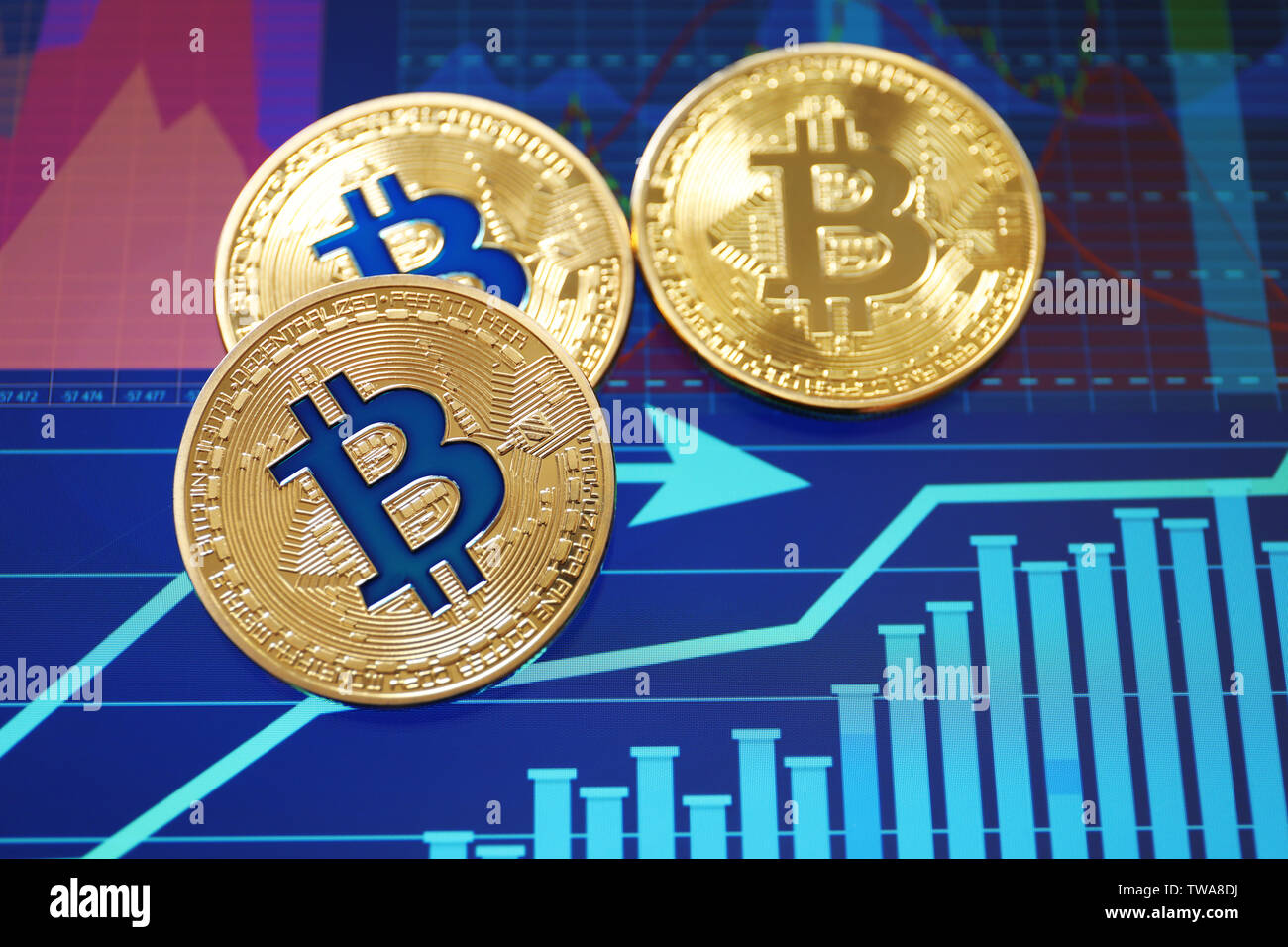Golden bitcoins on screen with chart. Finance trading Stock Photo - Alamy