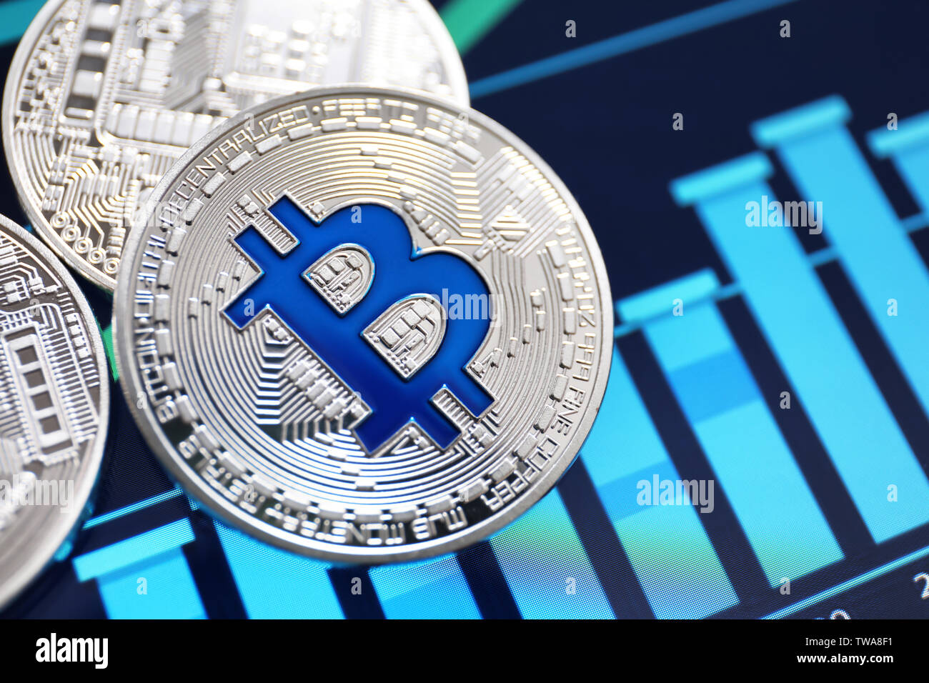 Silver bitcoins on screen with chart. Finance trading Stock Photo - Alamy