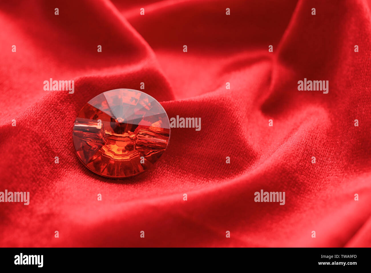 Precious stone for jewellery on red velvet Stock Photo - Alamy