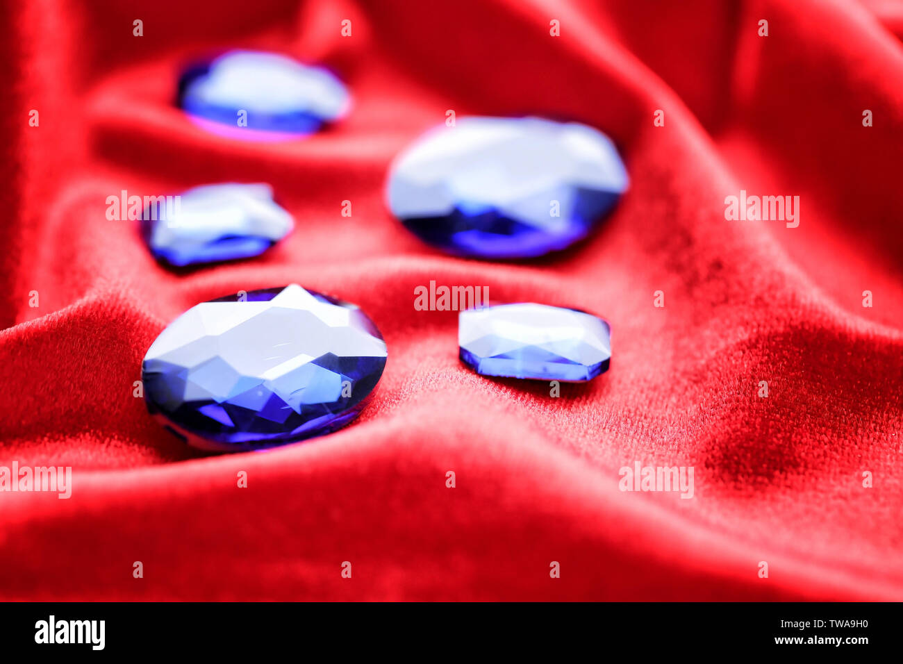 Precious stones for jewellery on red velvet Stock Photo - Alamy