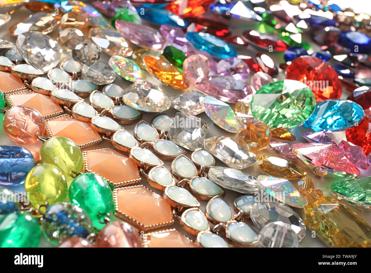 Jewellery with various colorful precious stones Stock Photo - Alamy