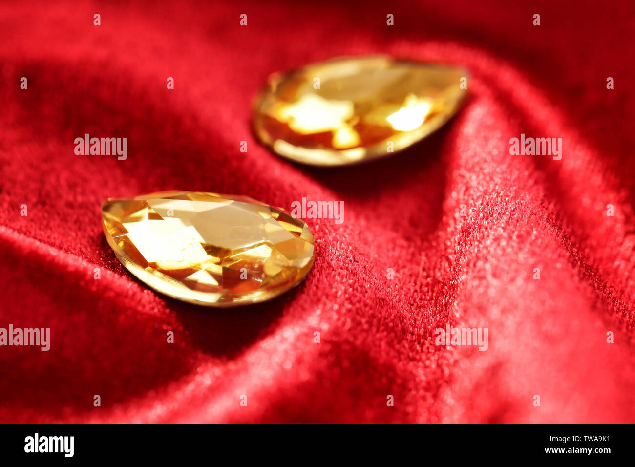 Precious stones for jewellery on red velvet Stock Photo - Alamy