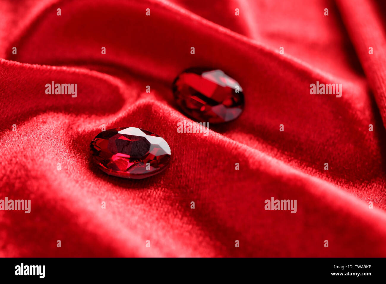 Precious stones for jewellery on red velvet Stock Photo - Alamy