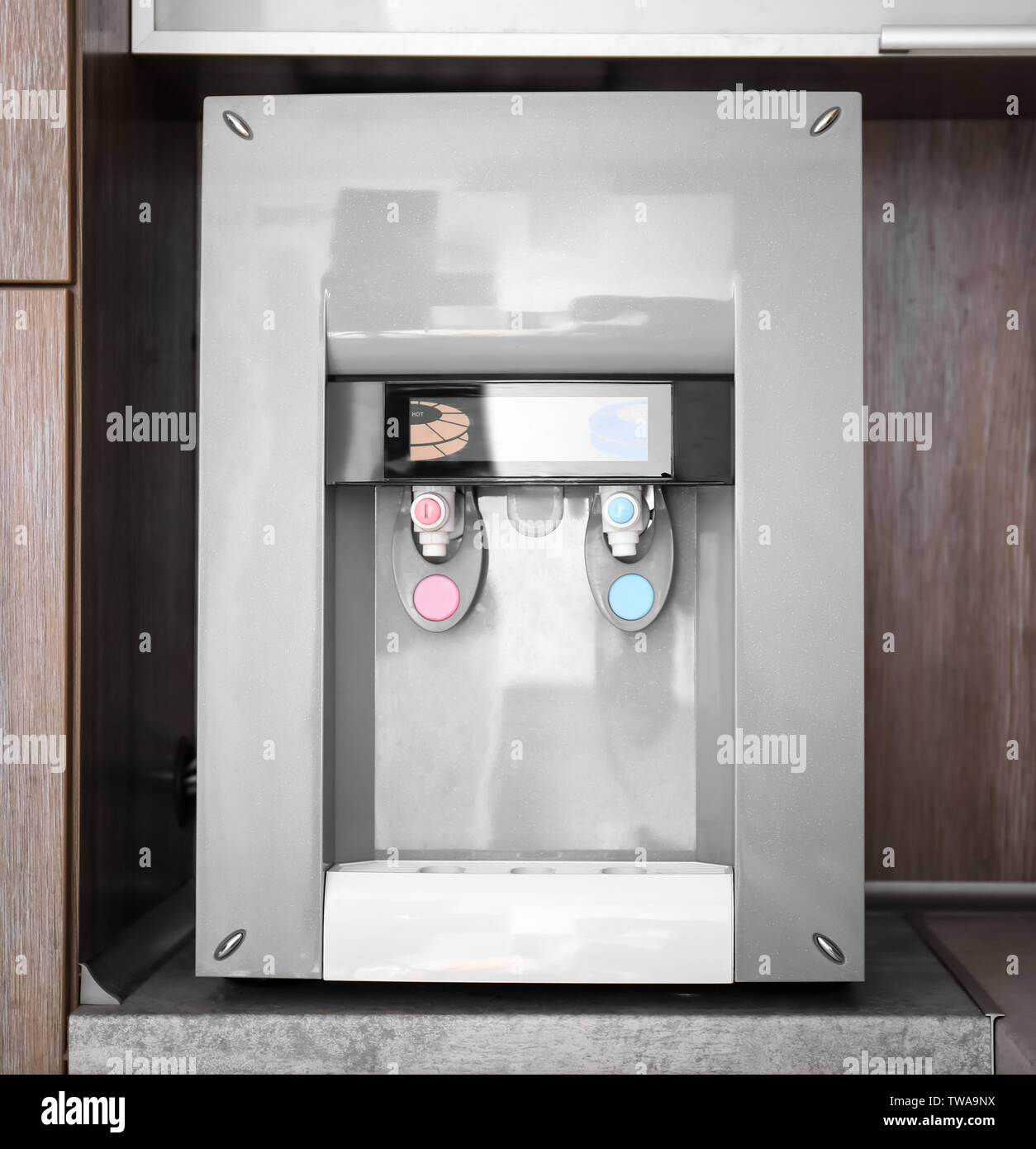 Modern water cooler on kitchen counter Stock Photo - Alamy