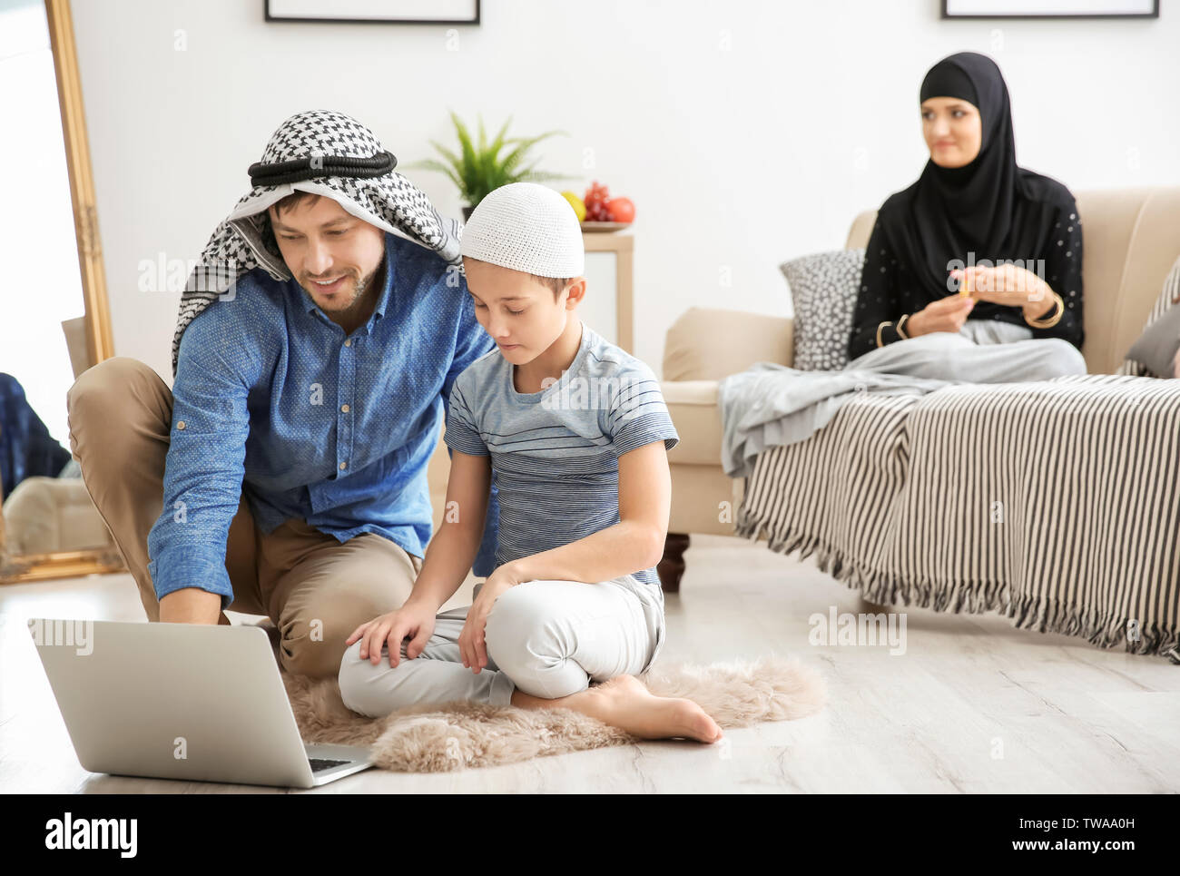 Happy Muslim family spending time together at home Stock Photo - Alamy