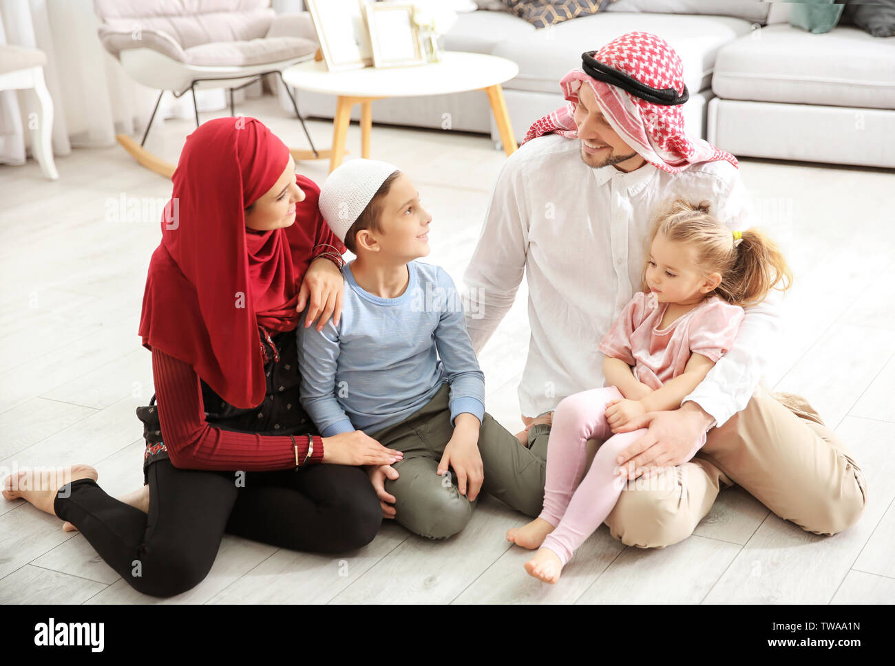 Happy Muslim family at home Stock Photo - Alamy