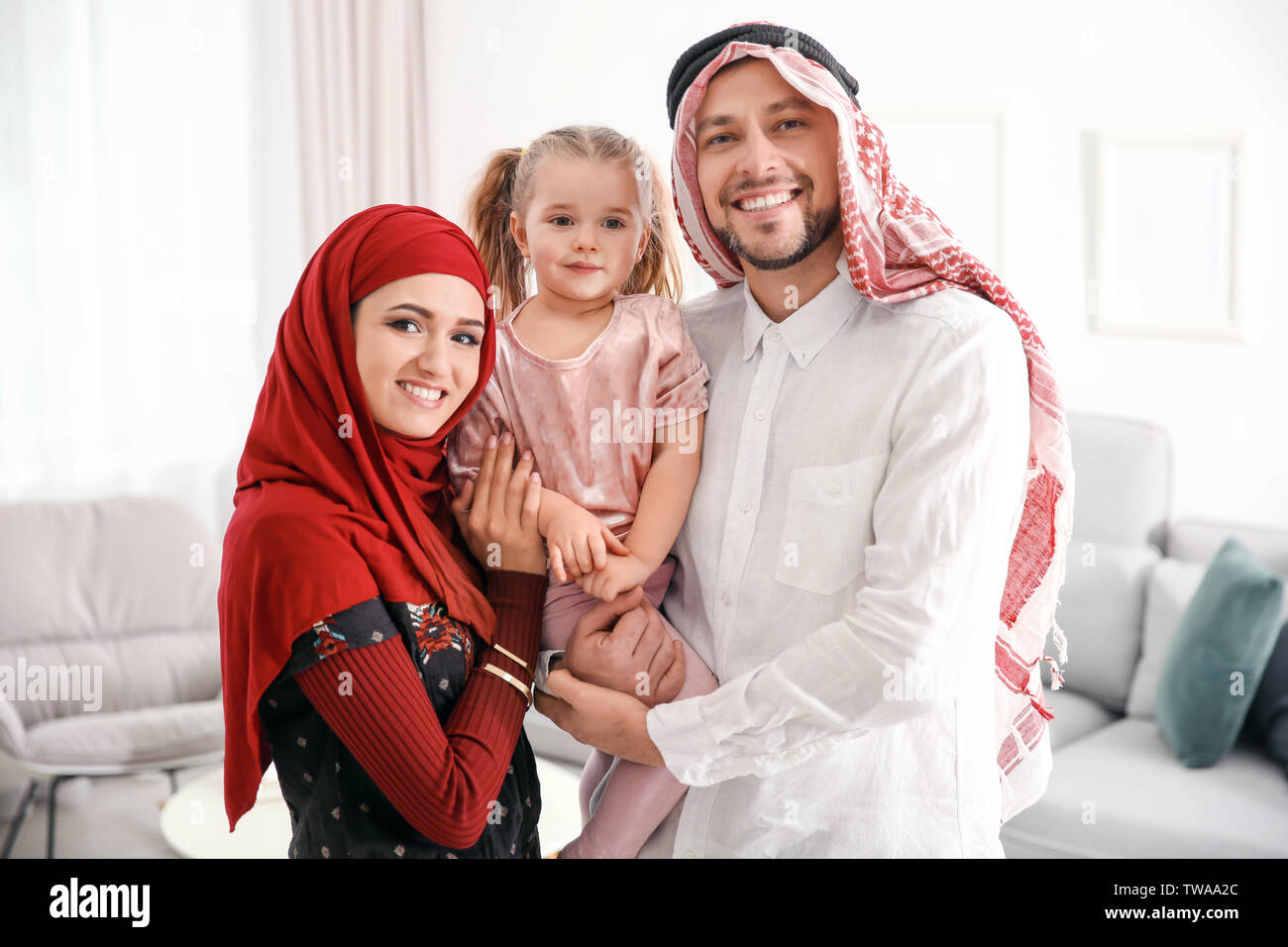 Happy Muslim family at home Stock Photo - Alamy
