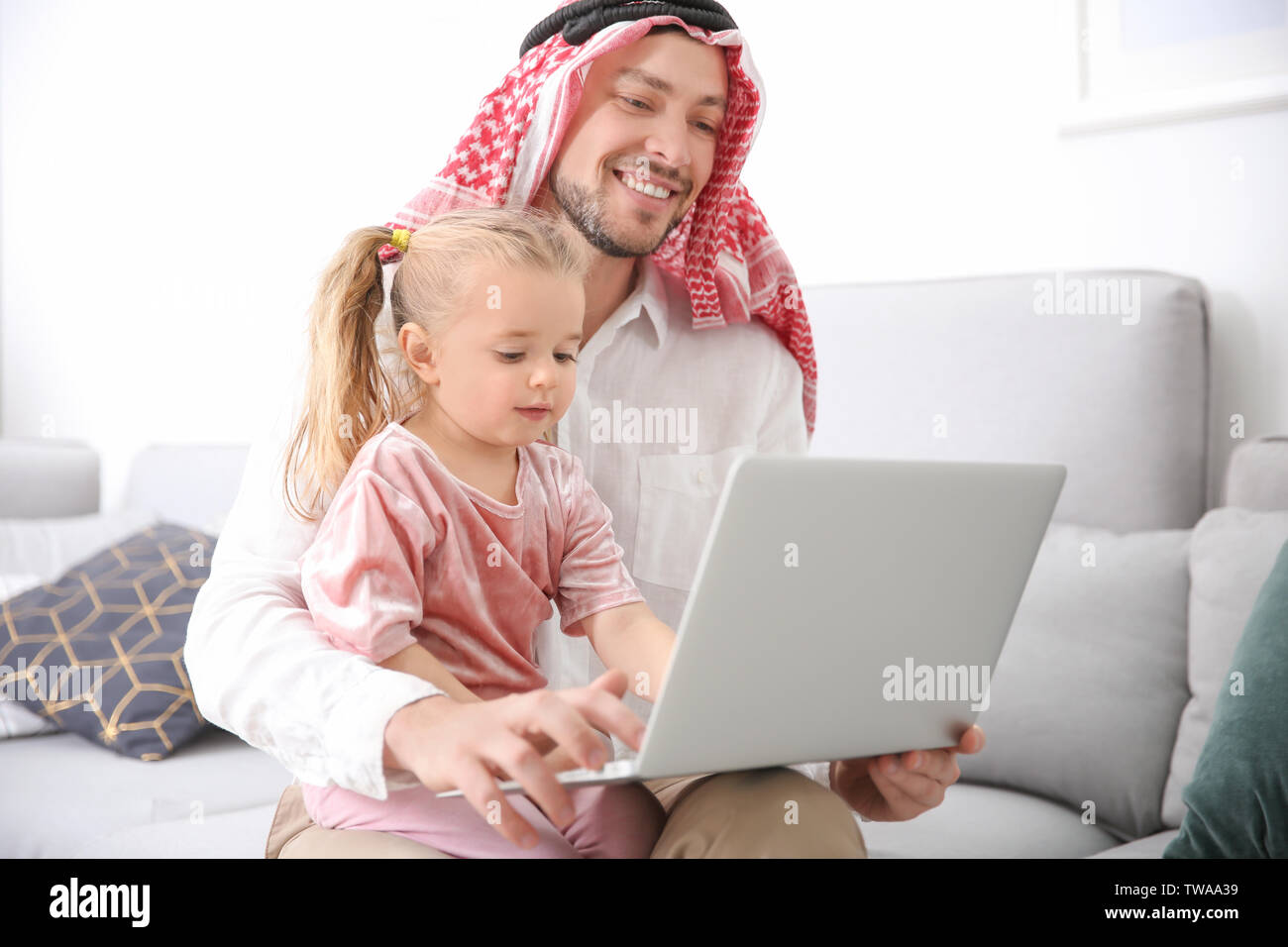 Modern muslim family sofa hi-res stock photography and images - Alamy