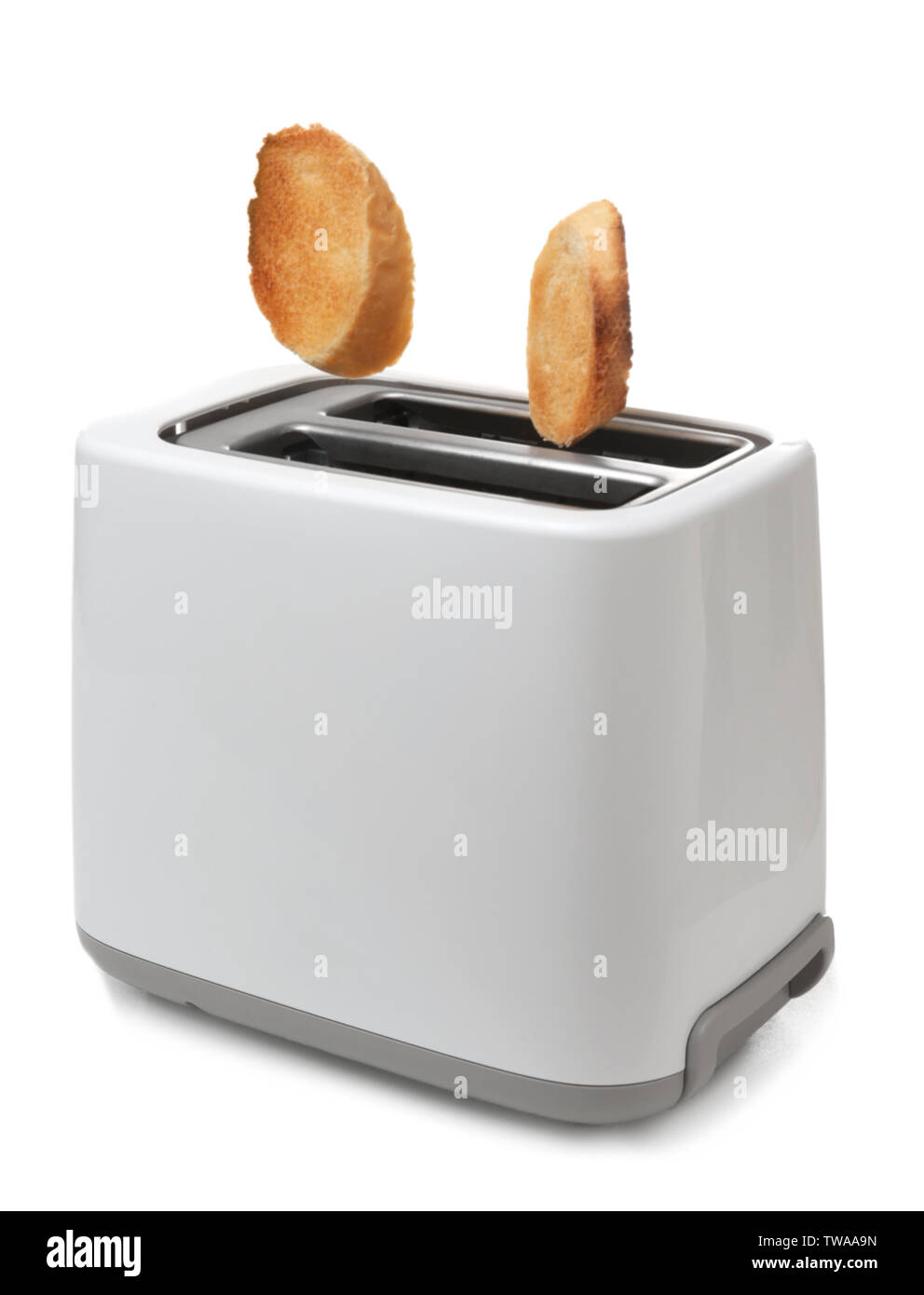 Slices of bread popping out of toaster against white background Stock ...