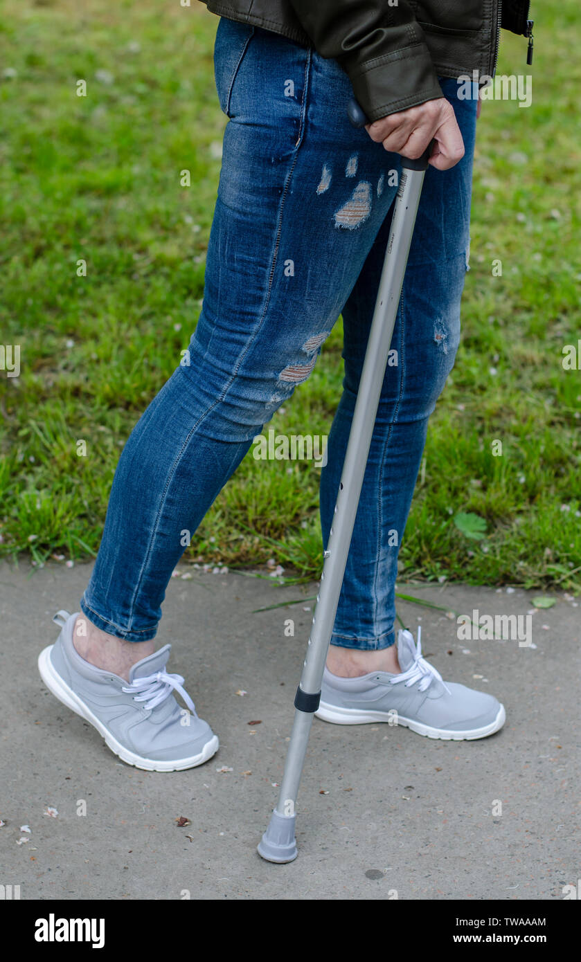 Senior woman on a rehabilitation after surgery or on recovery walks ...