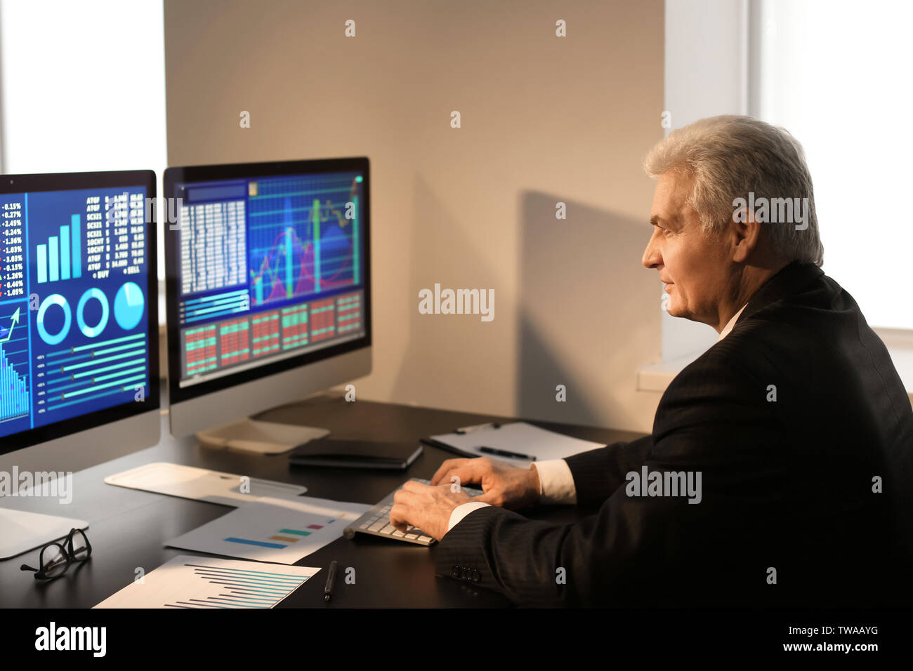 Male broker working in office. Finance trading concept Stock Photo - Alamy