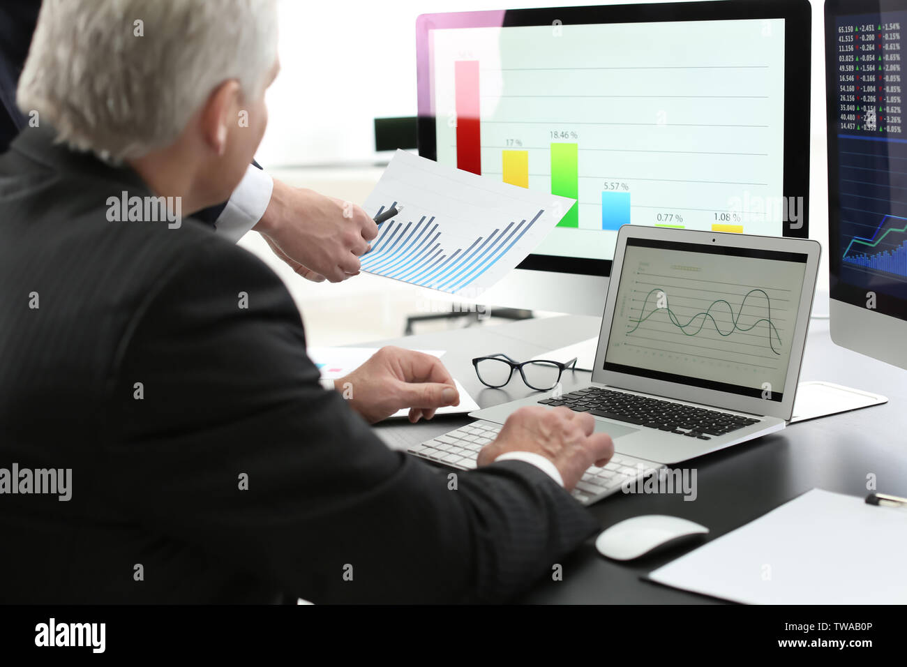 Male brokers working in office. Finance trading concept Stock Photo - Alamy