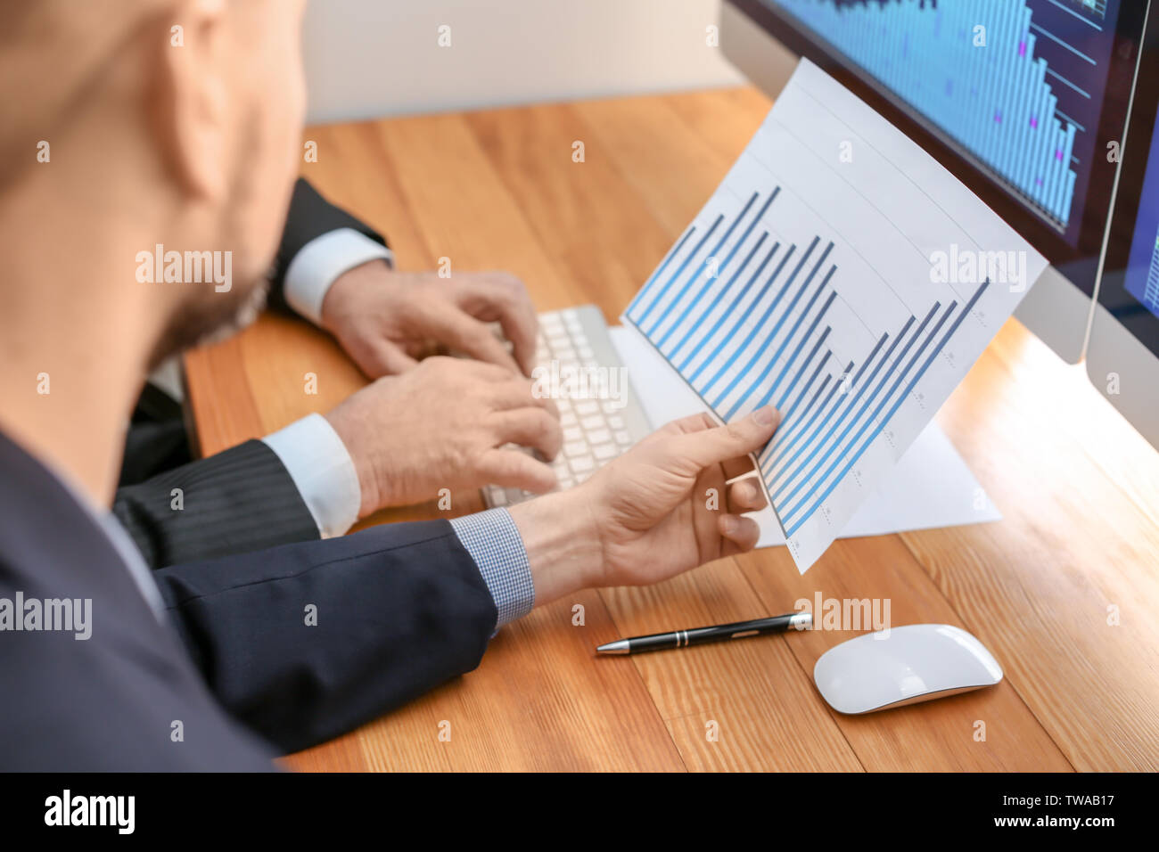 Male brokers working in office. Finance trading concept Stock Photo - Alamy