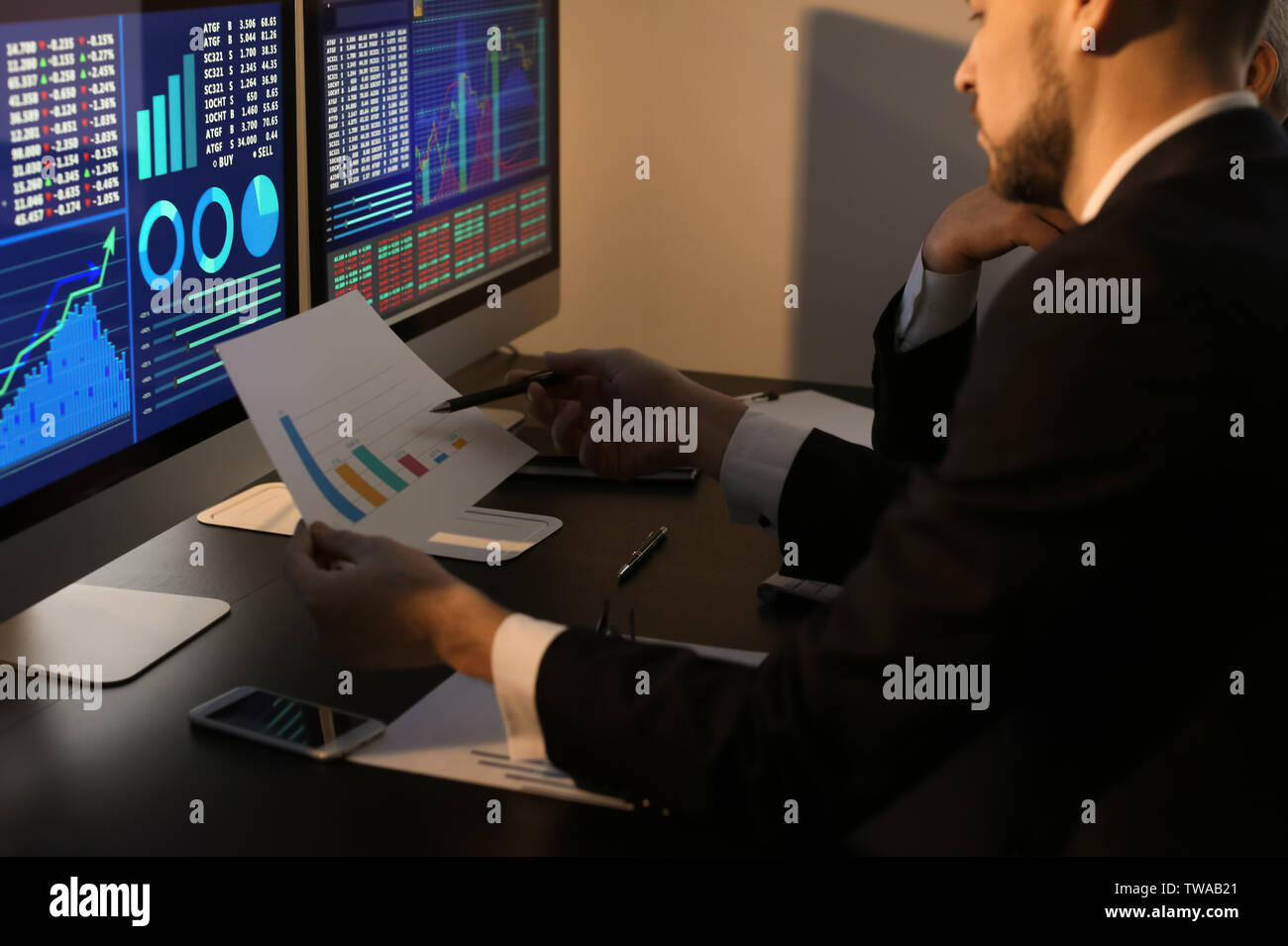 Male brokers working in office. Finance trading concept Stock Photo - Alamy
