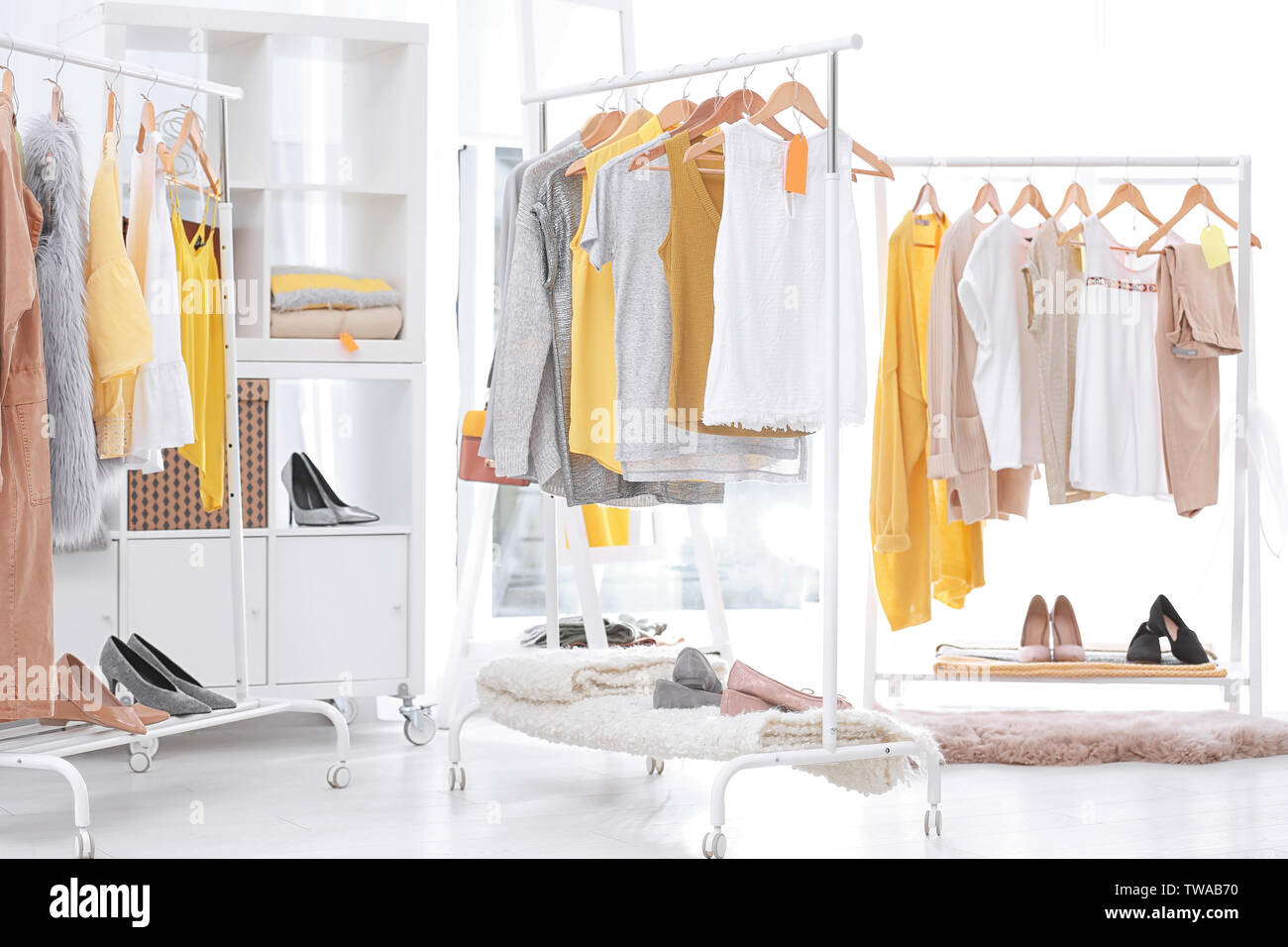 Different women wear in modern shop Stock Photo - Alamy