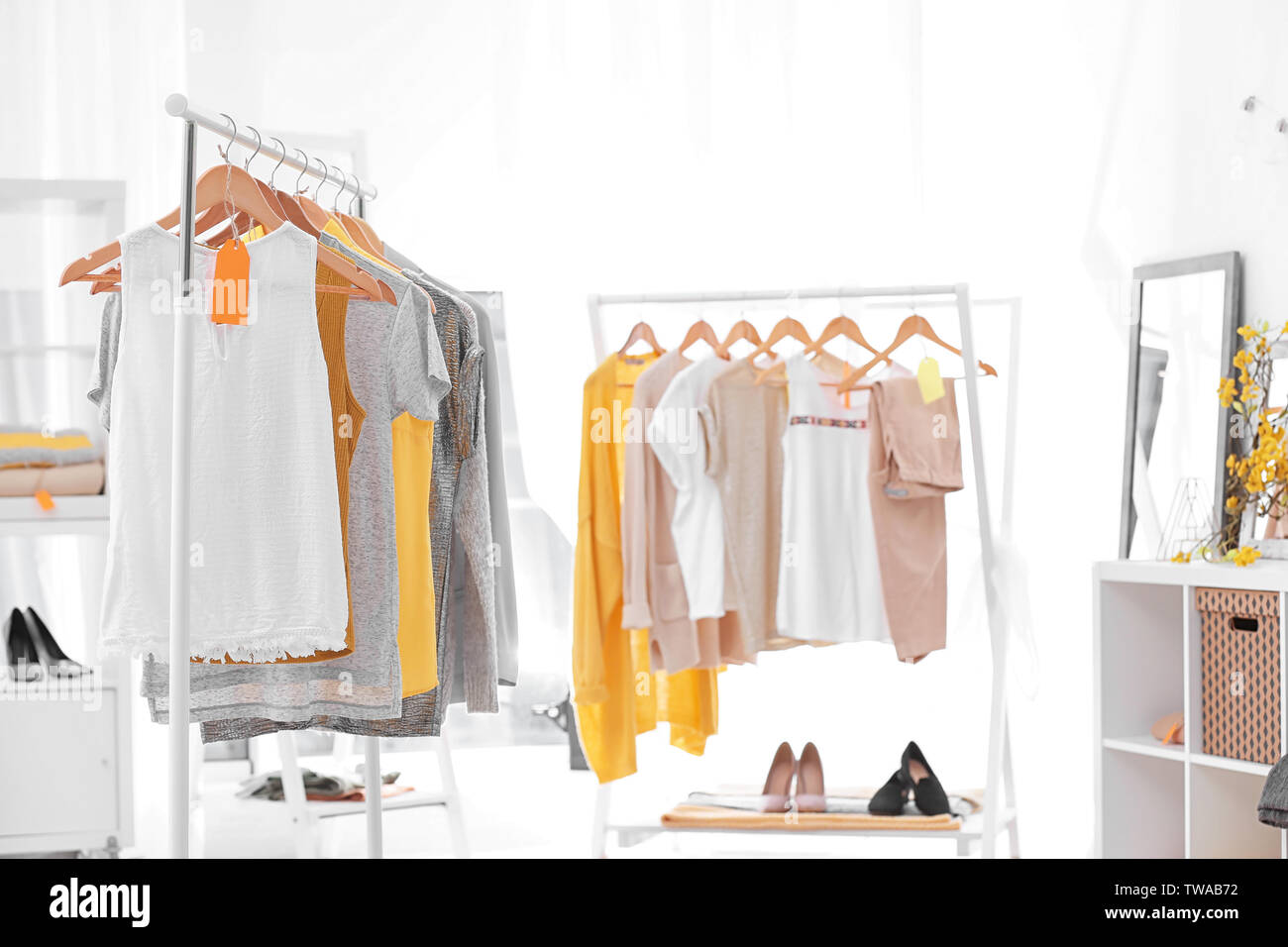 Different women wear in modern shop Stock Photo - Alamy