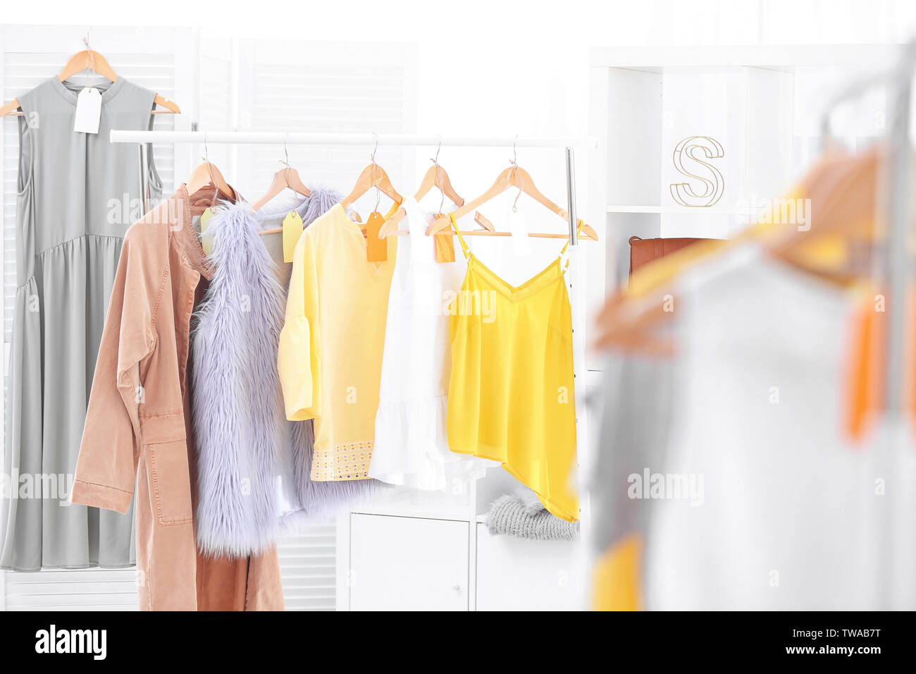 Different women wear in modern shop Stock Photo - Alamy