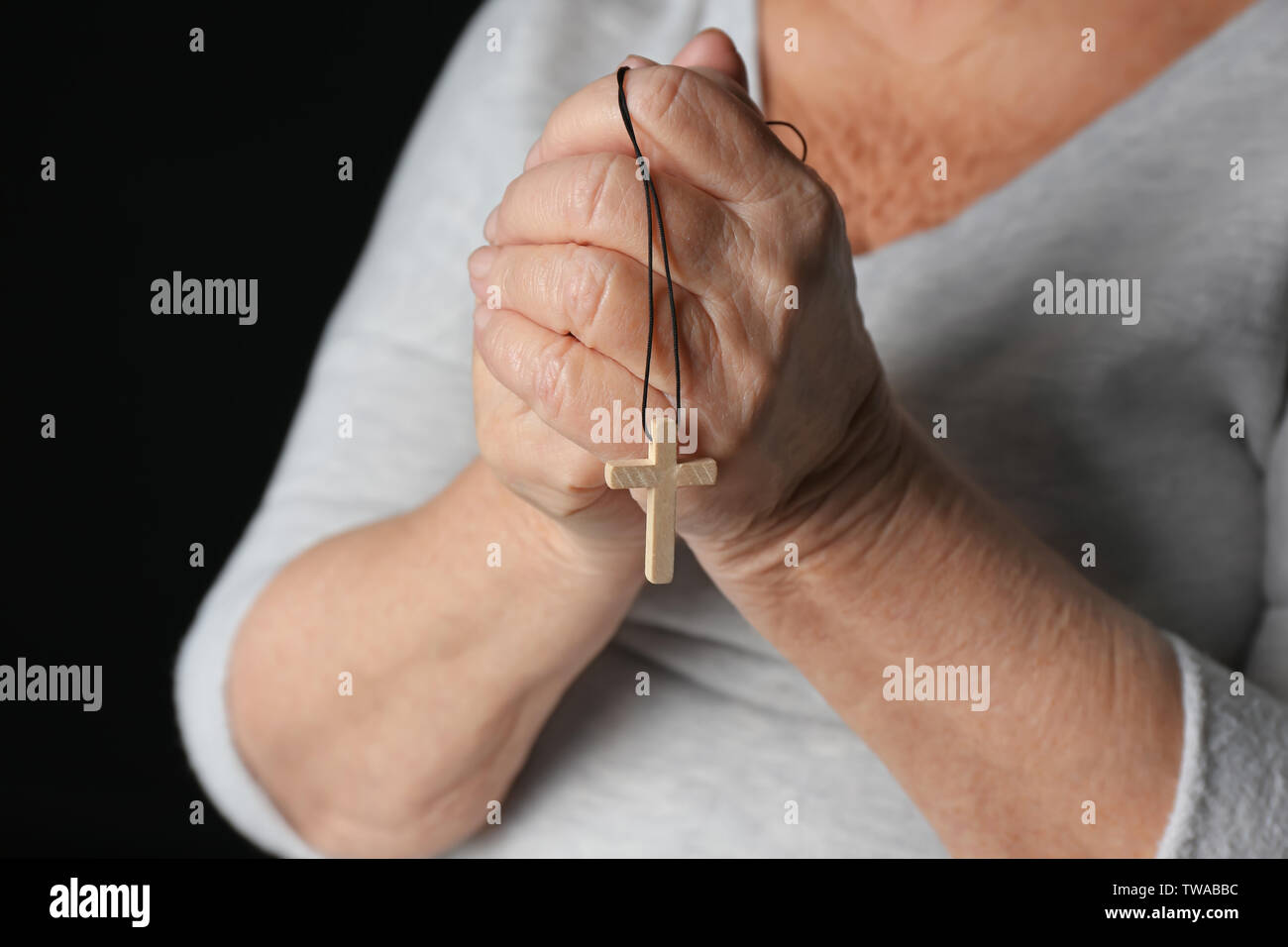 Religious elderly woman praying, closeup Stock Photo - Alamy