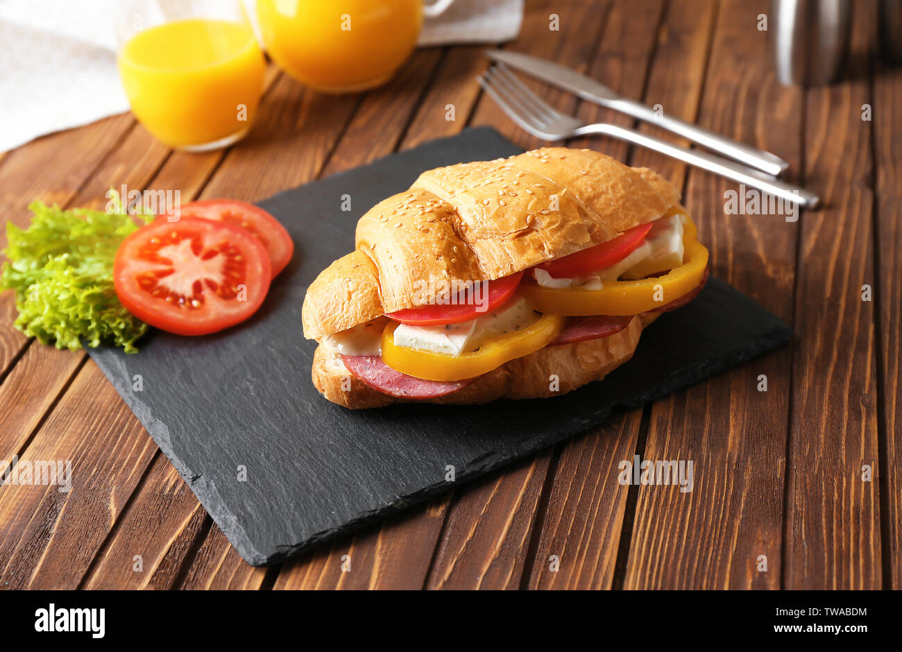 Tasty croissant sandwich on slate plate Stock Photo - Alamy