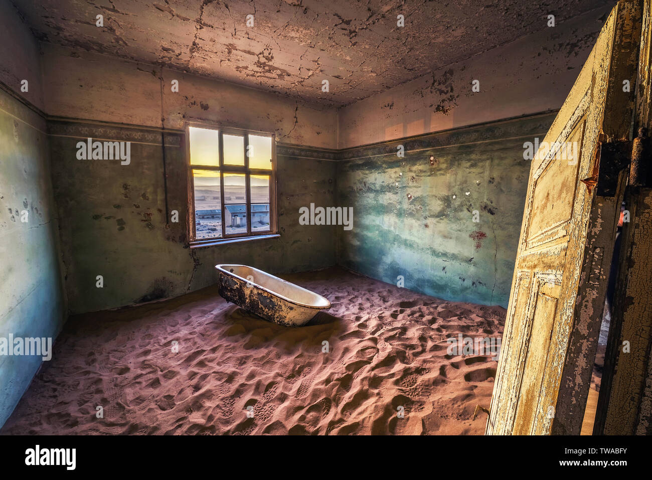 Ruins of the mining town Kolmanskop in the Namib desert near Luderitz ...