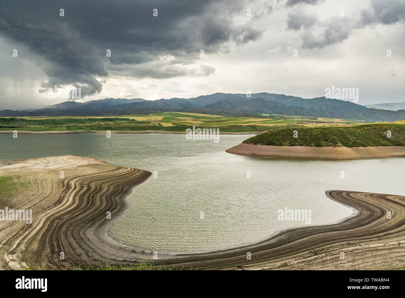 Hillside prairie villages under cloudy clouds Stock Photo - Alamy