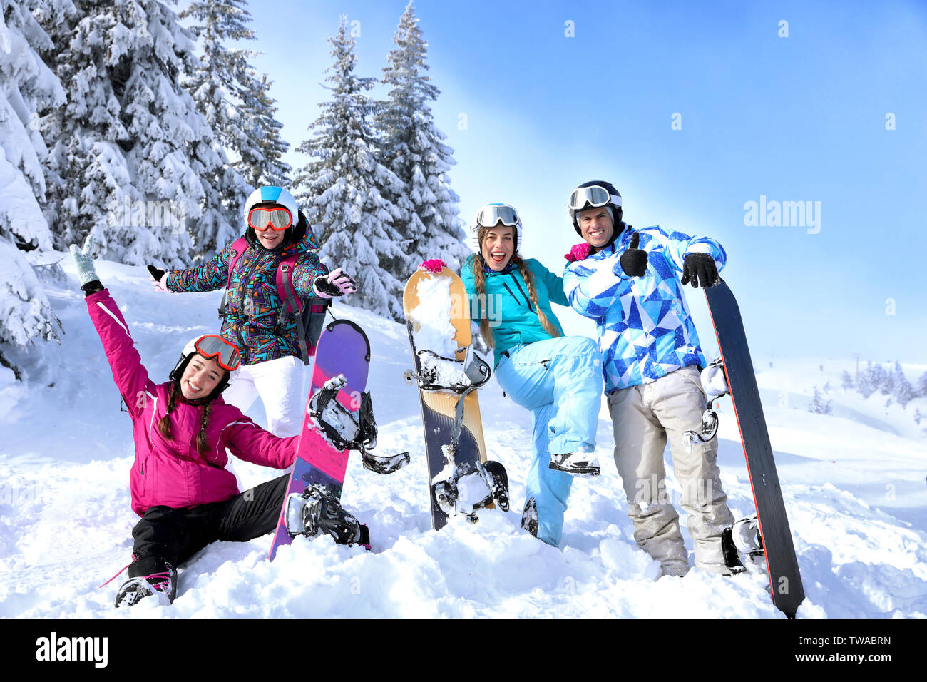 Friends at snowy ski resort. Winter vacation Stock Photo - Alamy