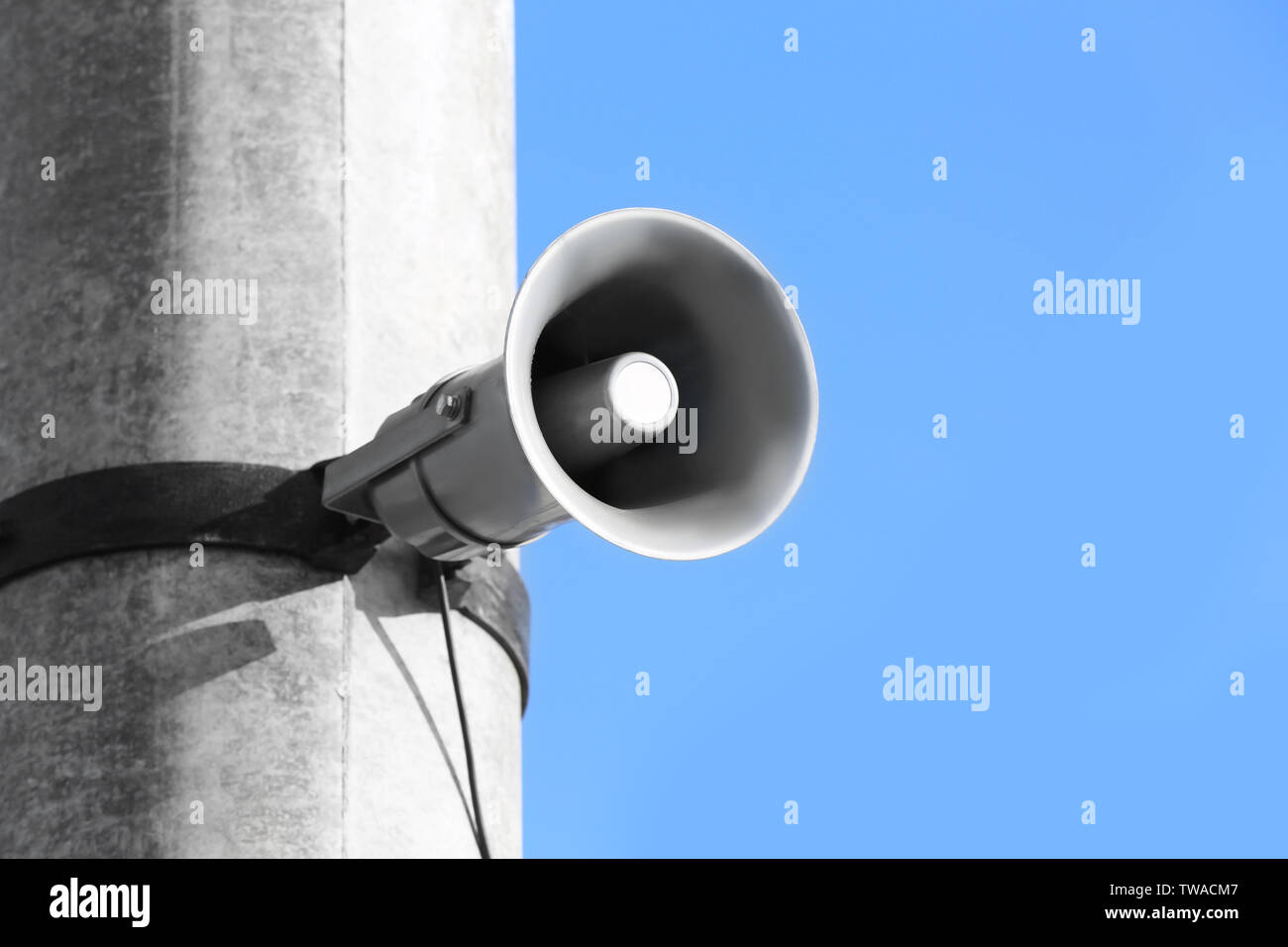 Megaphone on pole outdoors Stock Photo - Alamy