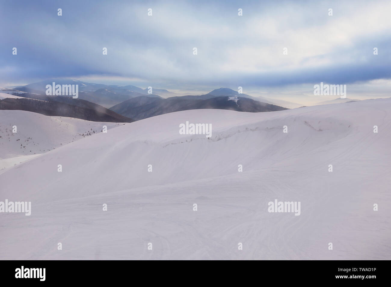 Ski slope at snowy resort on winter day Stock Photo - Alamy