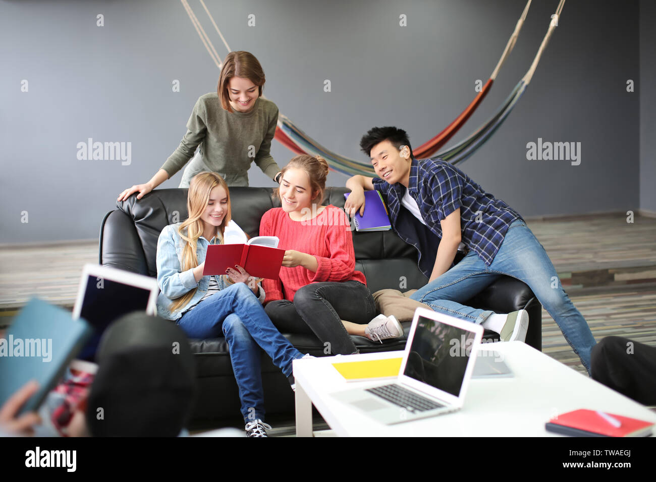 Students resting together in campus building Stock Photo - Alamy