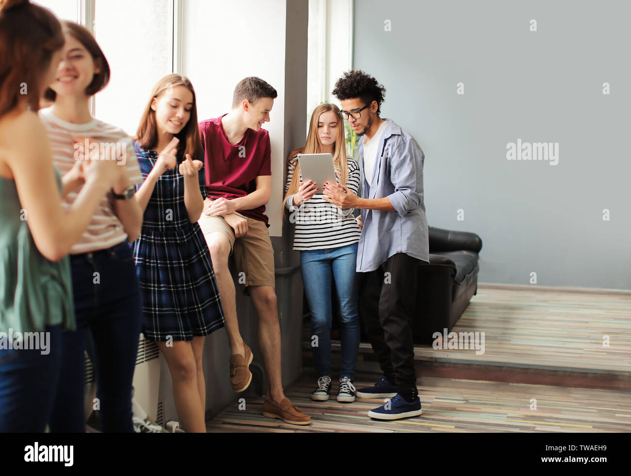 Students resting together in campus building Stock Photo - Alamy