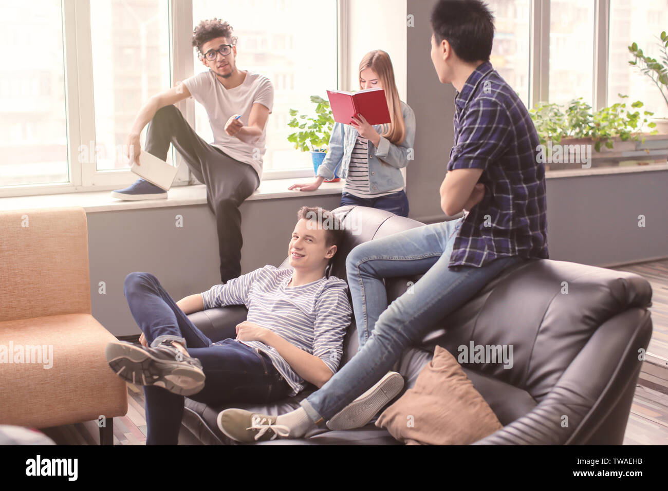 Students resting together in campus building Stock Photo - Alamy