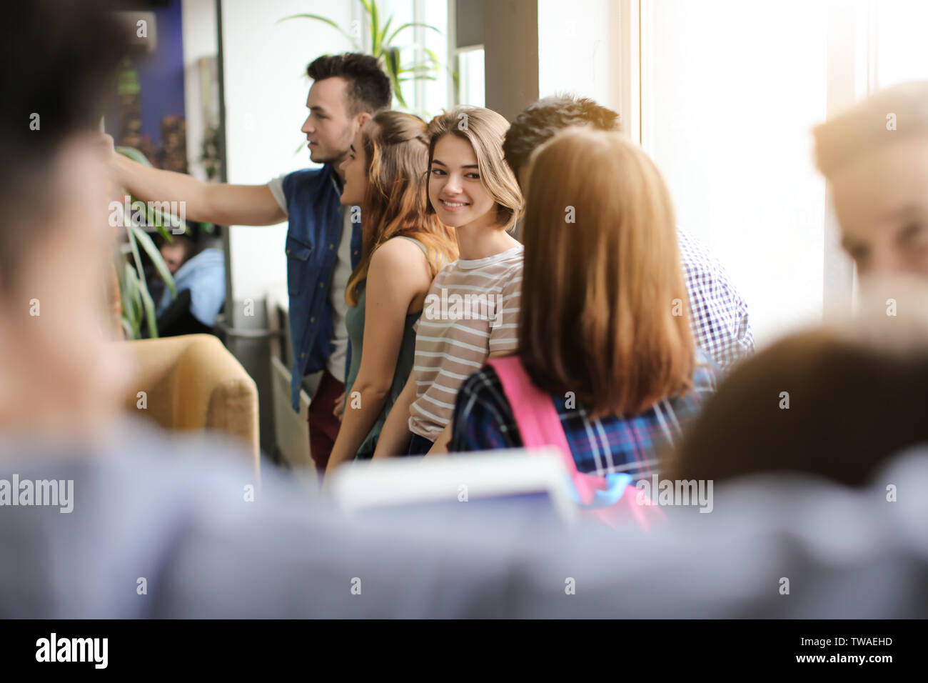 Students resting together in campus building Stock Photo - Alamy