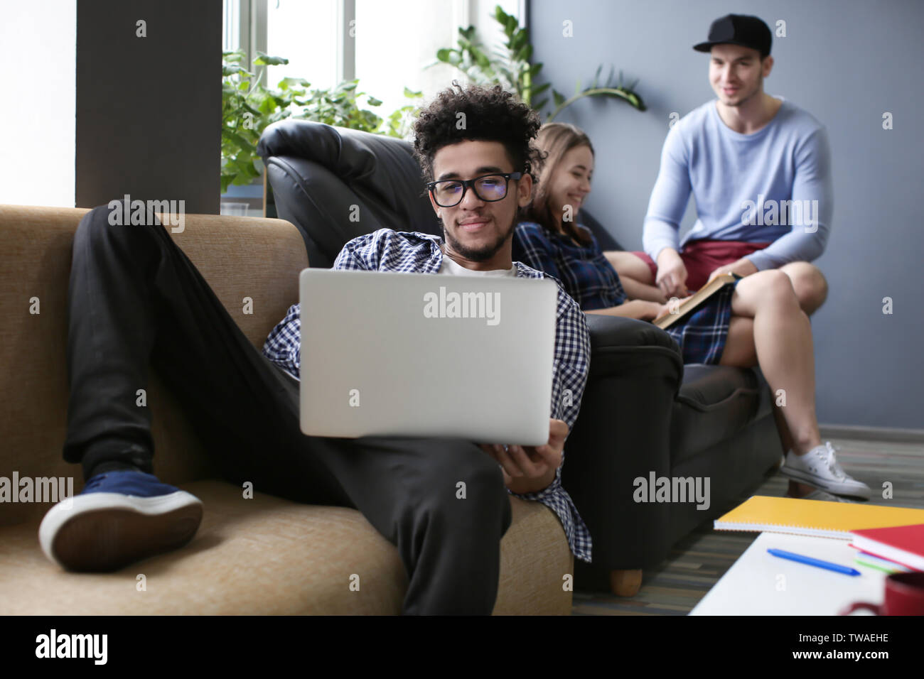 Students resting together in campus building Stock Photo - Alamy