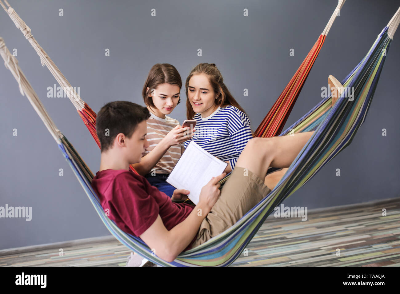 Students resting together in campus building Stock Photo - Alamy