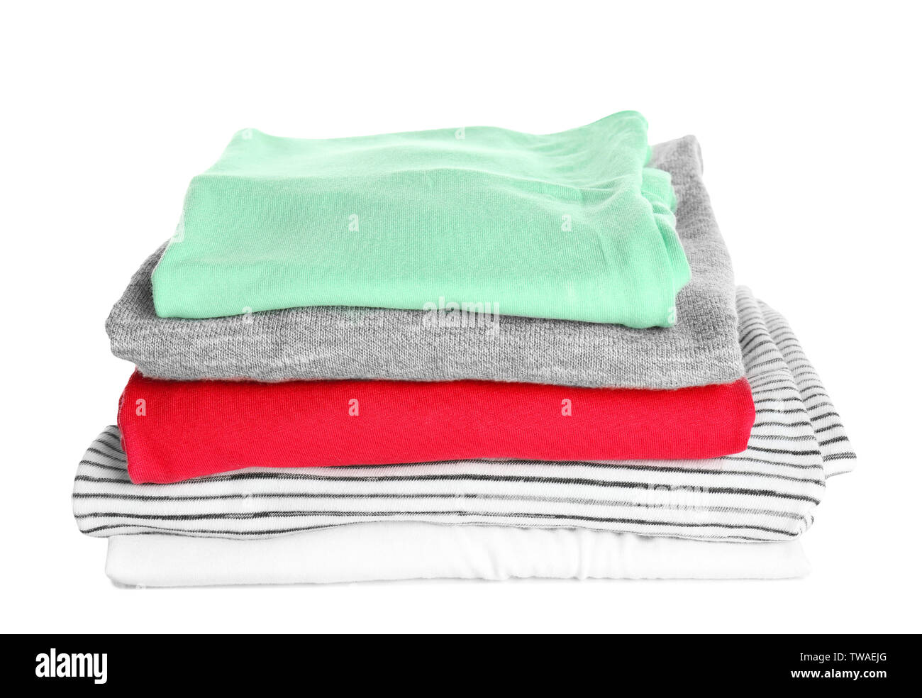 Stack of clothes on white background. Laundry day Stock Photo - Alamy
