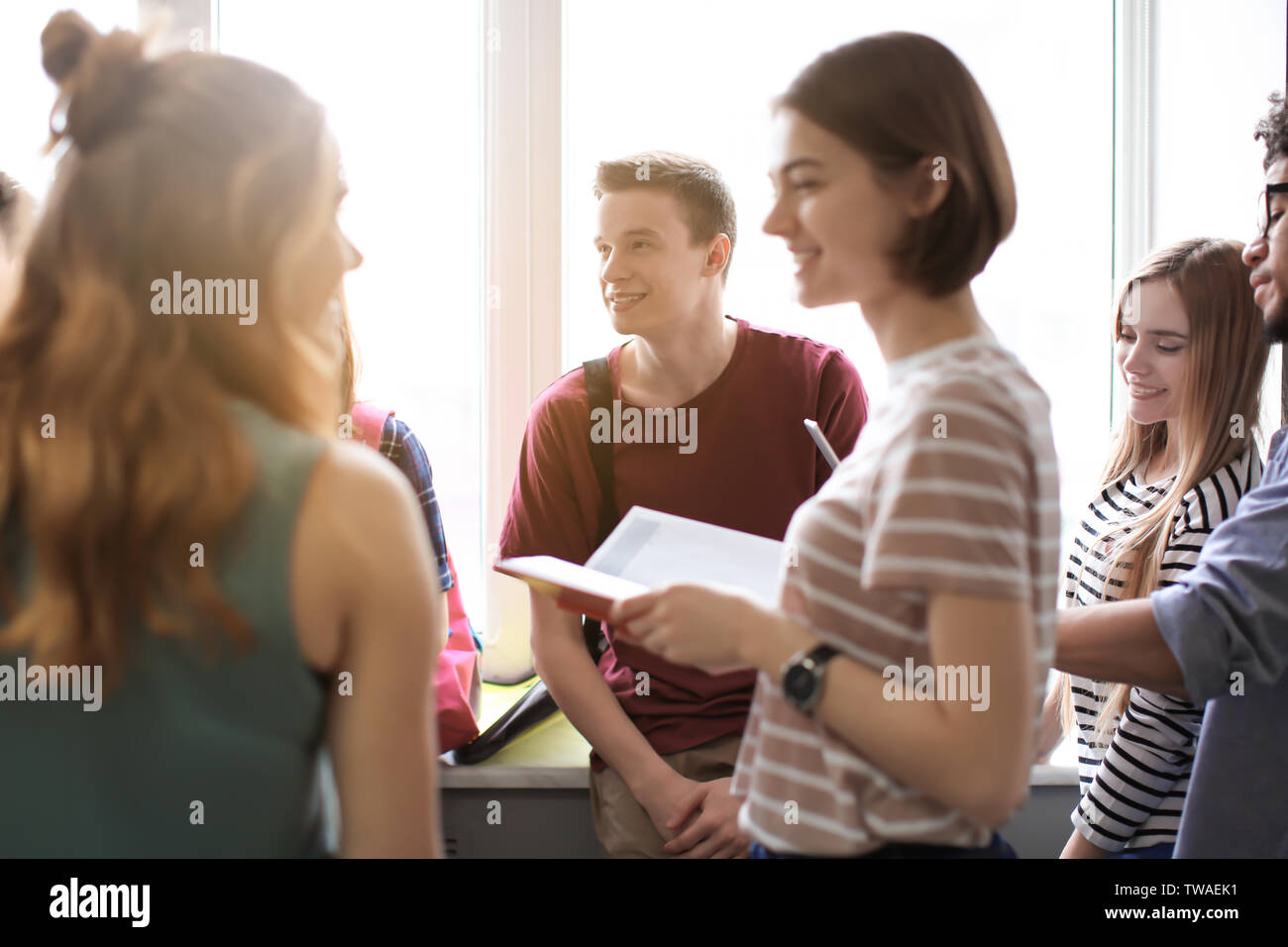 Students resting together in campus building Stock Photo - Alamy