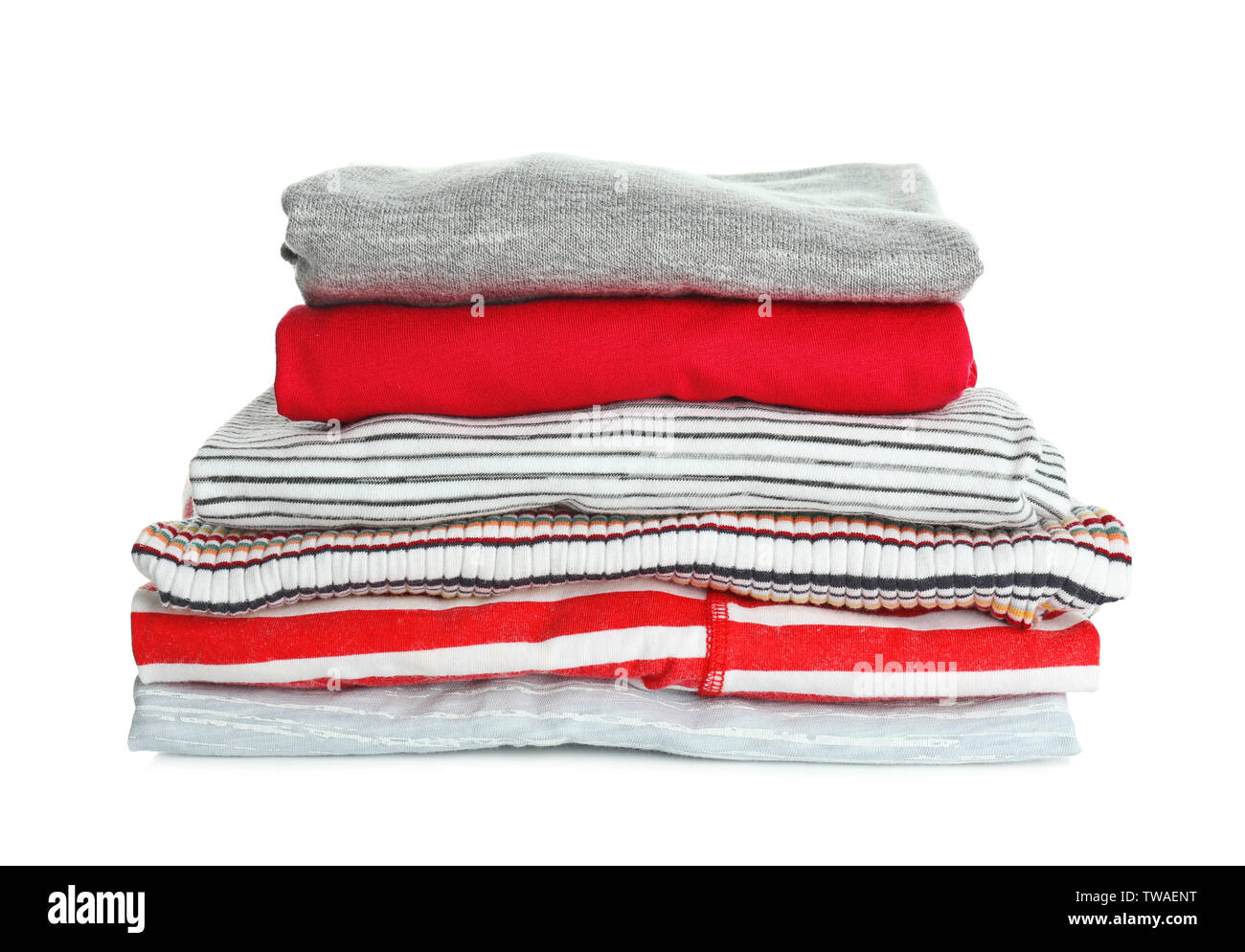 Stack of clothes on white background. Laundry day Stock Photo - Alamy