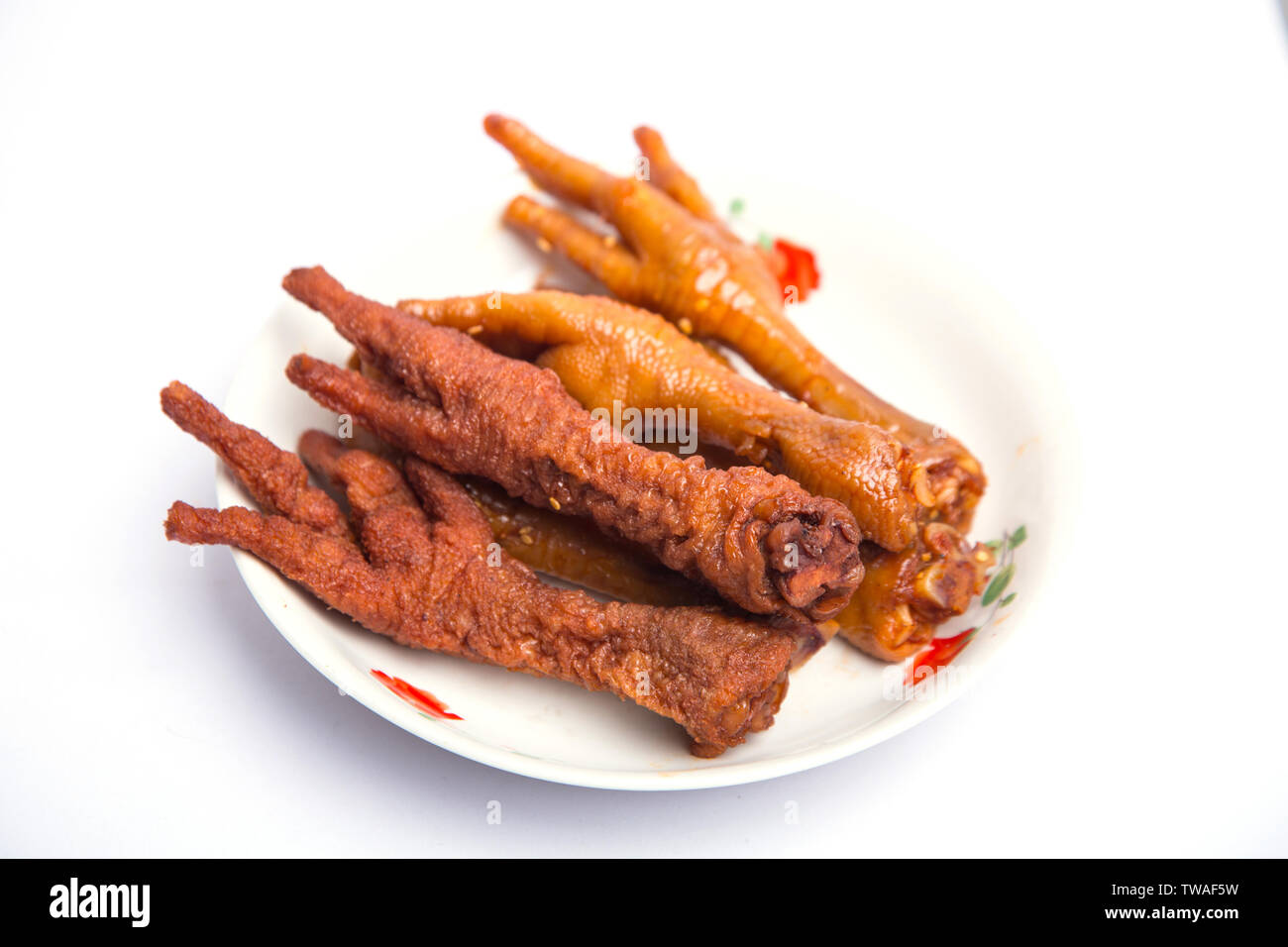 halogen chicken claws Stock Photo - Alamy
