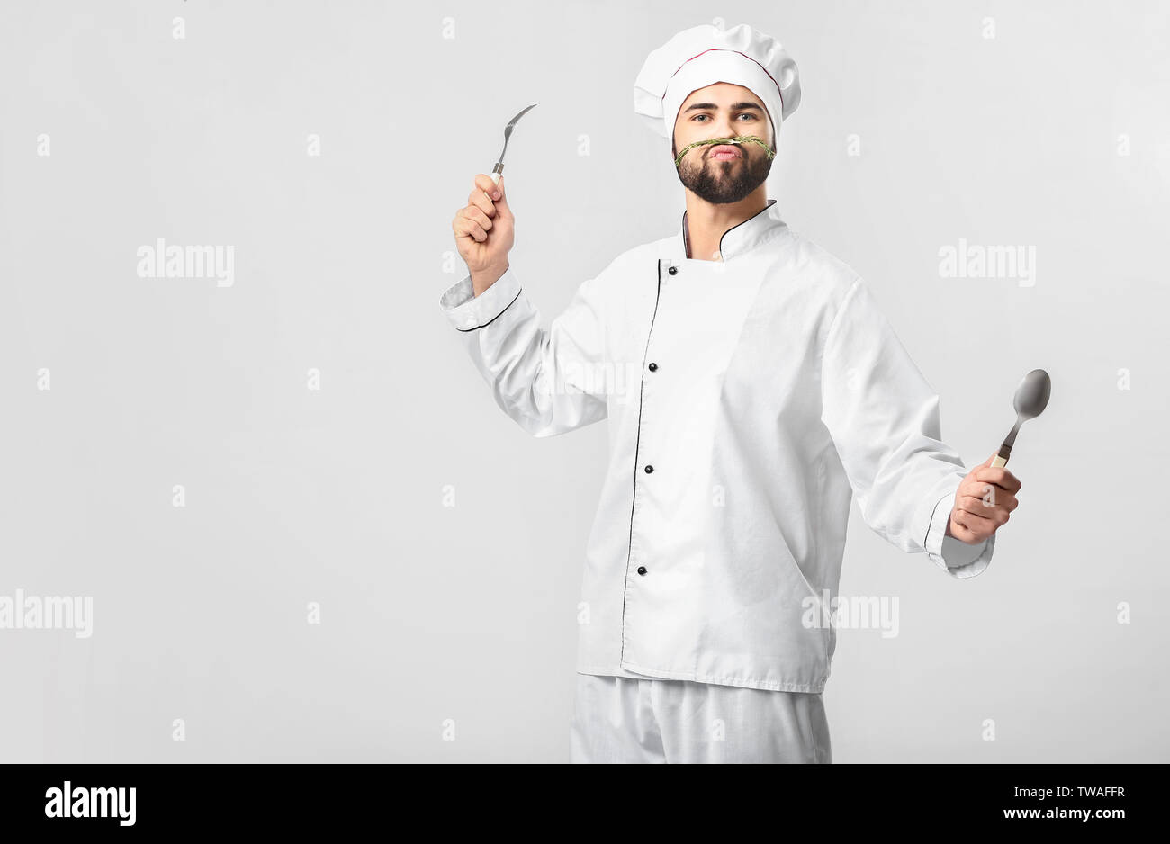Funny male chef on white background Stock Photo - Alamy
