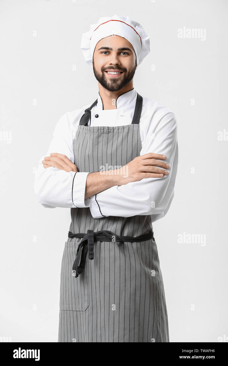 Handsome male chef on white background Stock Photo - Alamy