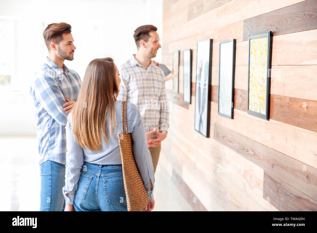 People at exhibition in modern art gallery Stock Photo - Alamy