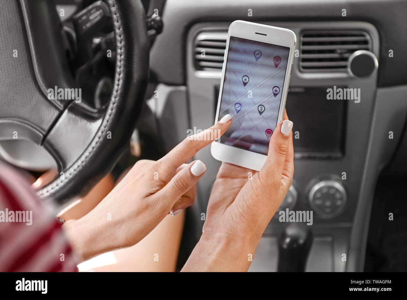 Car driver using mobile phone for navigation Stock Photo - Alamy