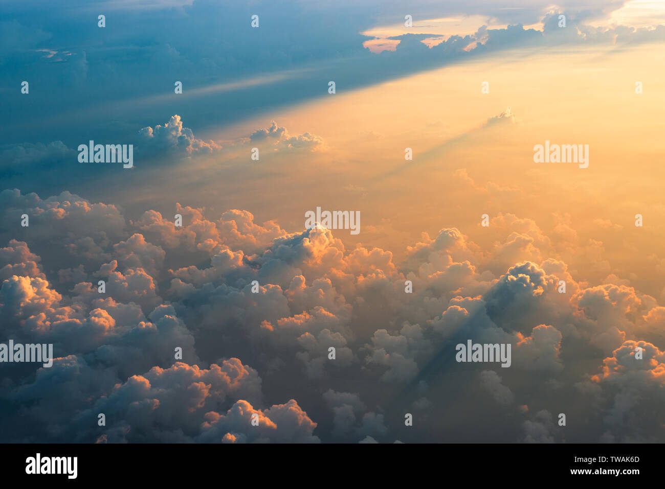 Beautiful aerial view of clouds at sunset, some clouds projecting ...